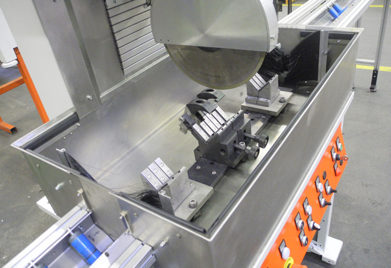 Automatic cut-off machine grinds work pieces with a diameter of up to ...